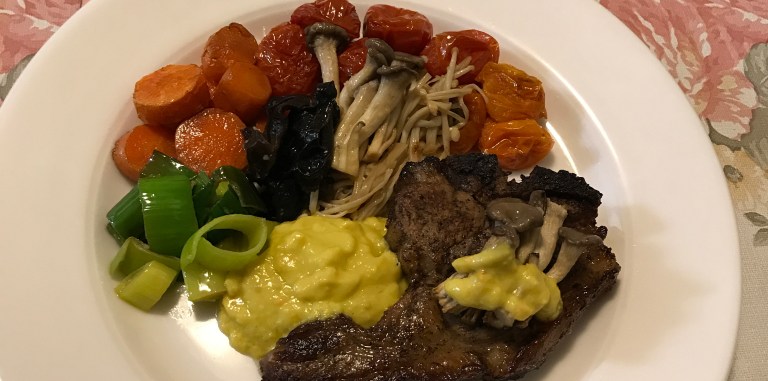 Roasted lamb and vegetables served in avocado bellino tomatoes yoghurt ...