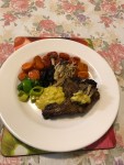 Roasted lamb and vegetables served in avocado bellino tomatoes yoghurt ...
