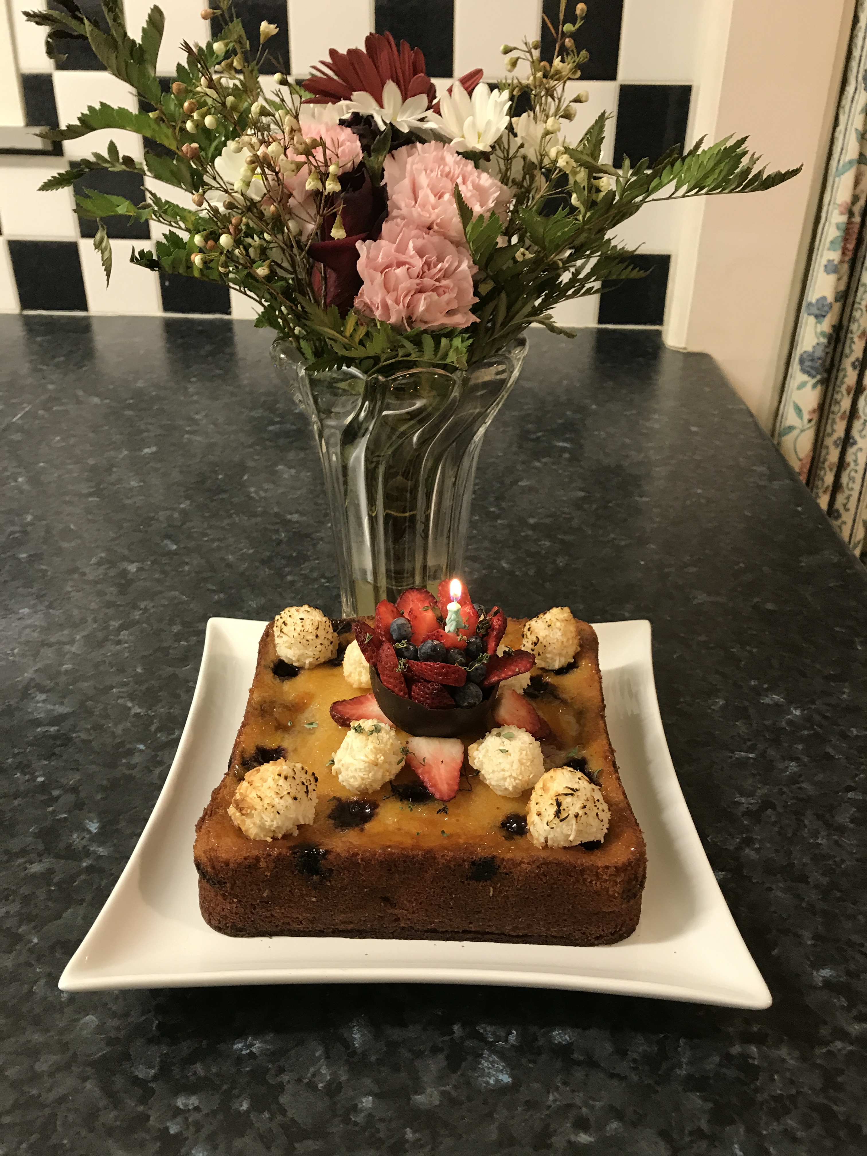 Rosemary berries butter cake with berries chocolate cup and lemon ...