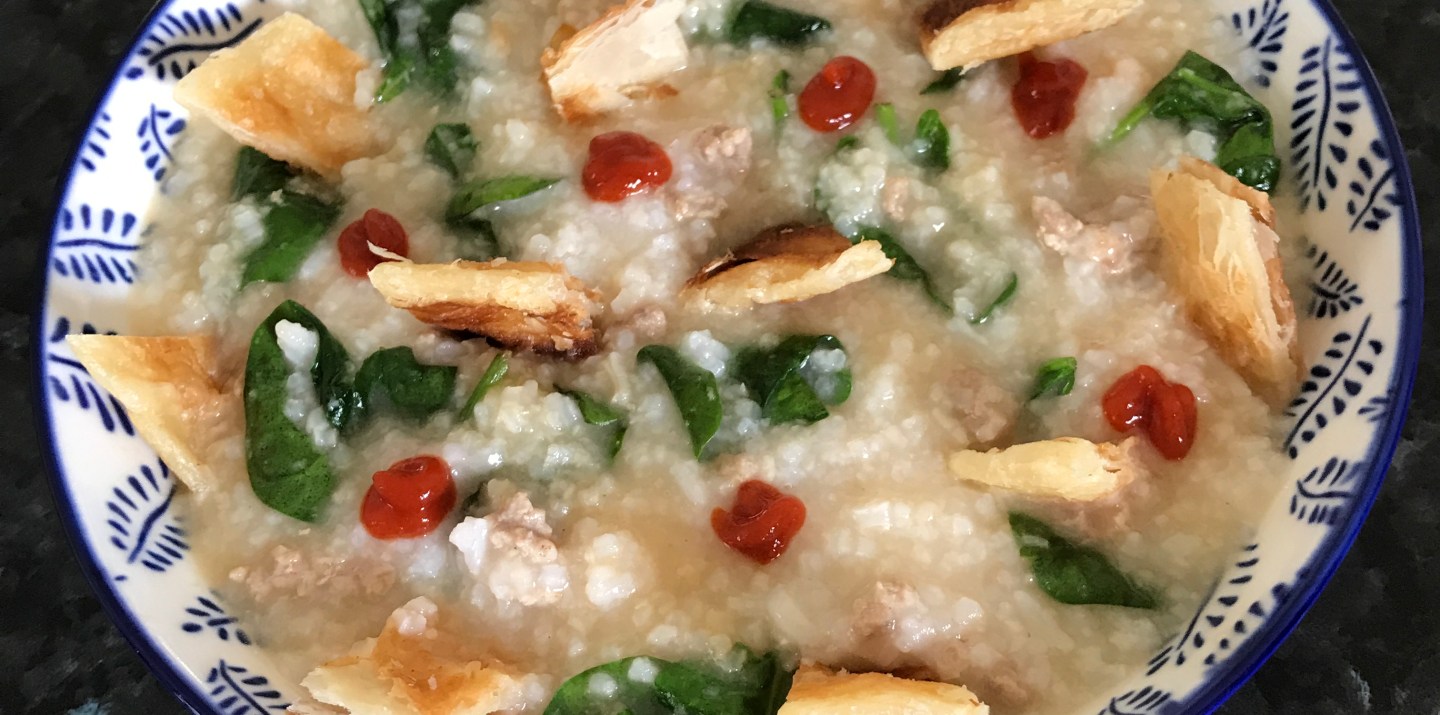 Shredded chicken minced pork spinach congee with paratha and chili ...