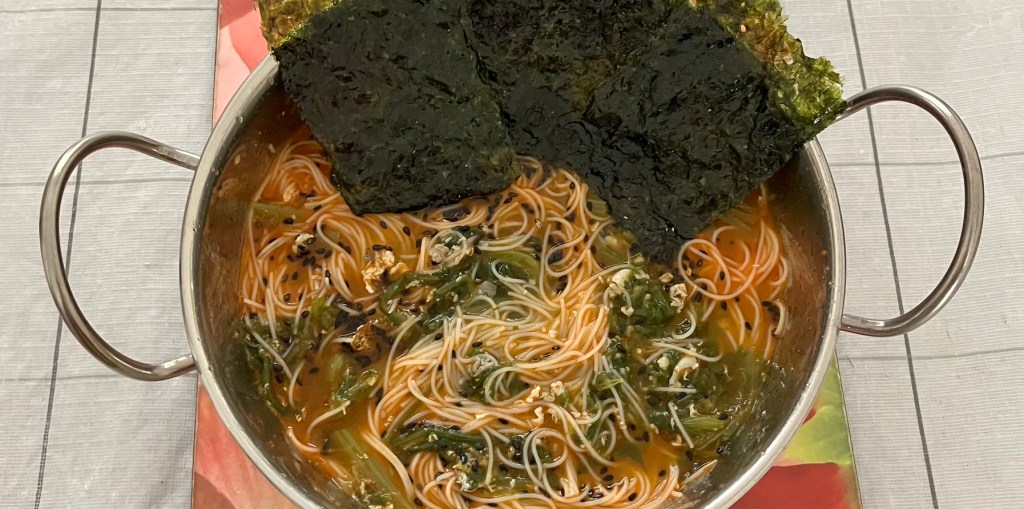 Spicy miso butter bee hoon mushroom tang oh soup with sea weeds and ...
