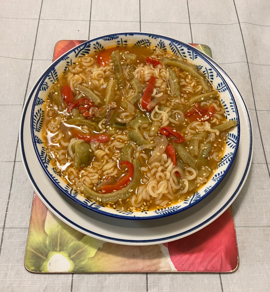Shin ram yun noodles soup with bitter gourd capsicum and sesame seeds ...